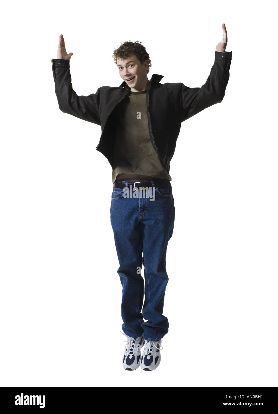 Portrait of a young man jumping in mid air Stock Photo - Alamy