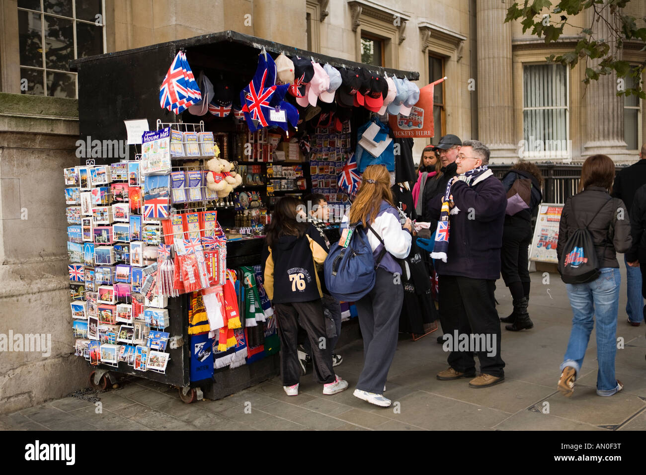 UK London Trafalgar Square visitors buying souvenirs from stall next to ...