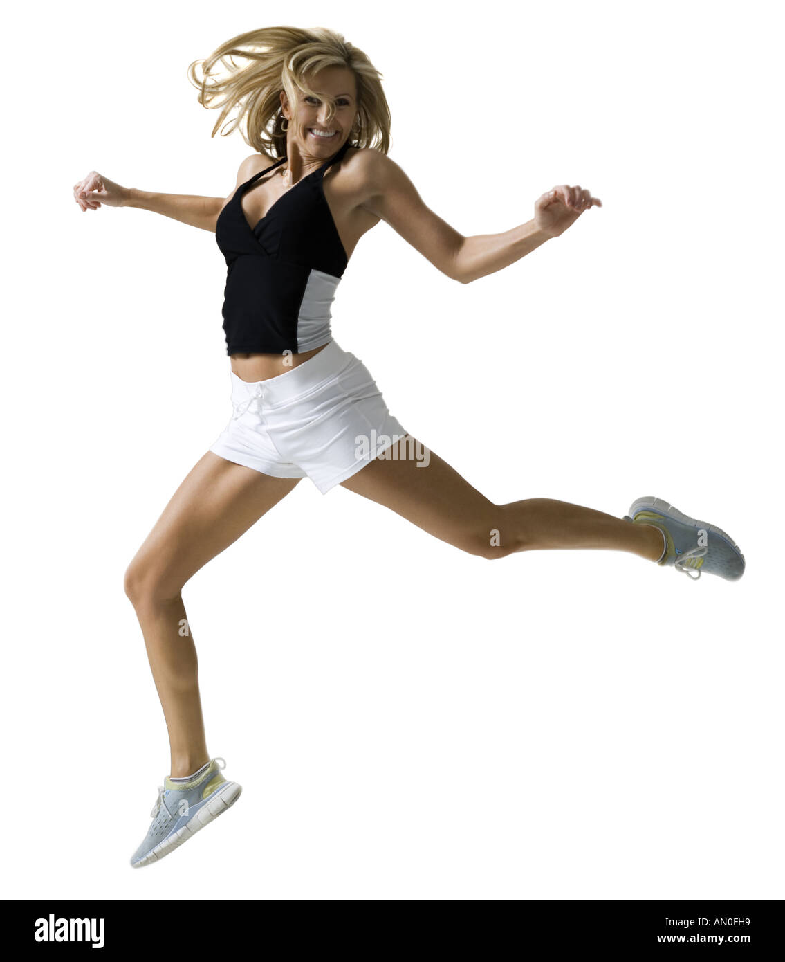 Portrait of a woman jumping Stock Photo - Alamy