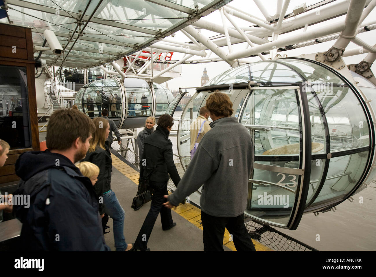 UK London South Bank BA London Eye passengers boarding capsule Stock ...