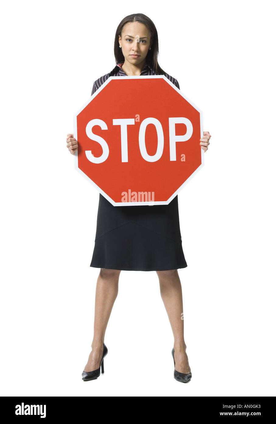 Portrait of a young woman holding a stop sign board Stock Photo - Alamy