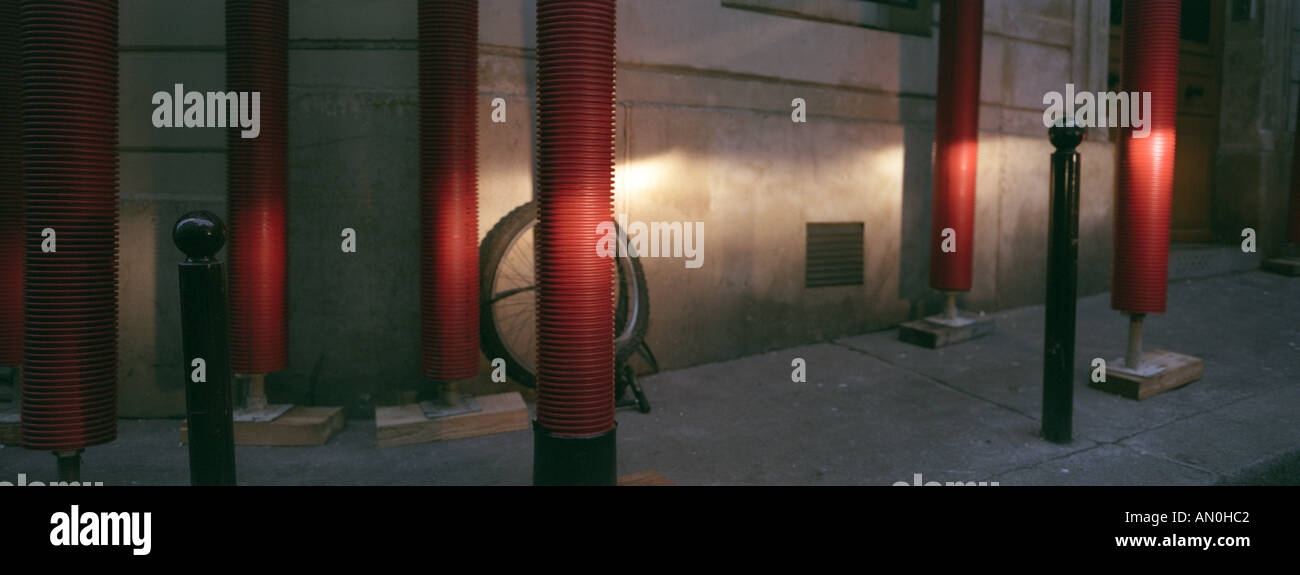 Paris France streets with red poles Stock Photo - Alamy