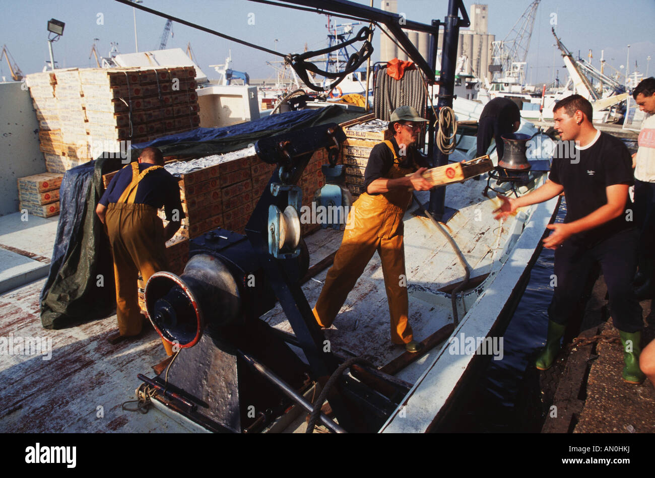 Fishermen offloading catch from boat hi-res stock photography and ...