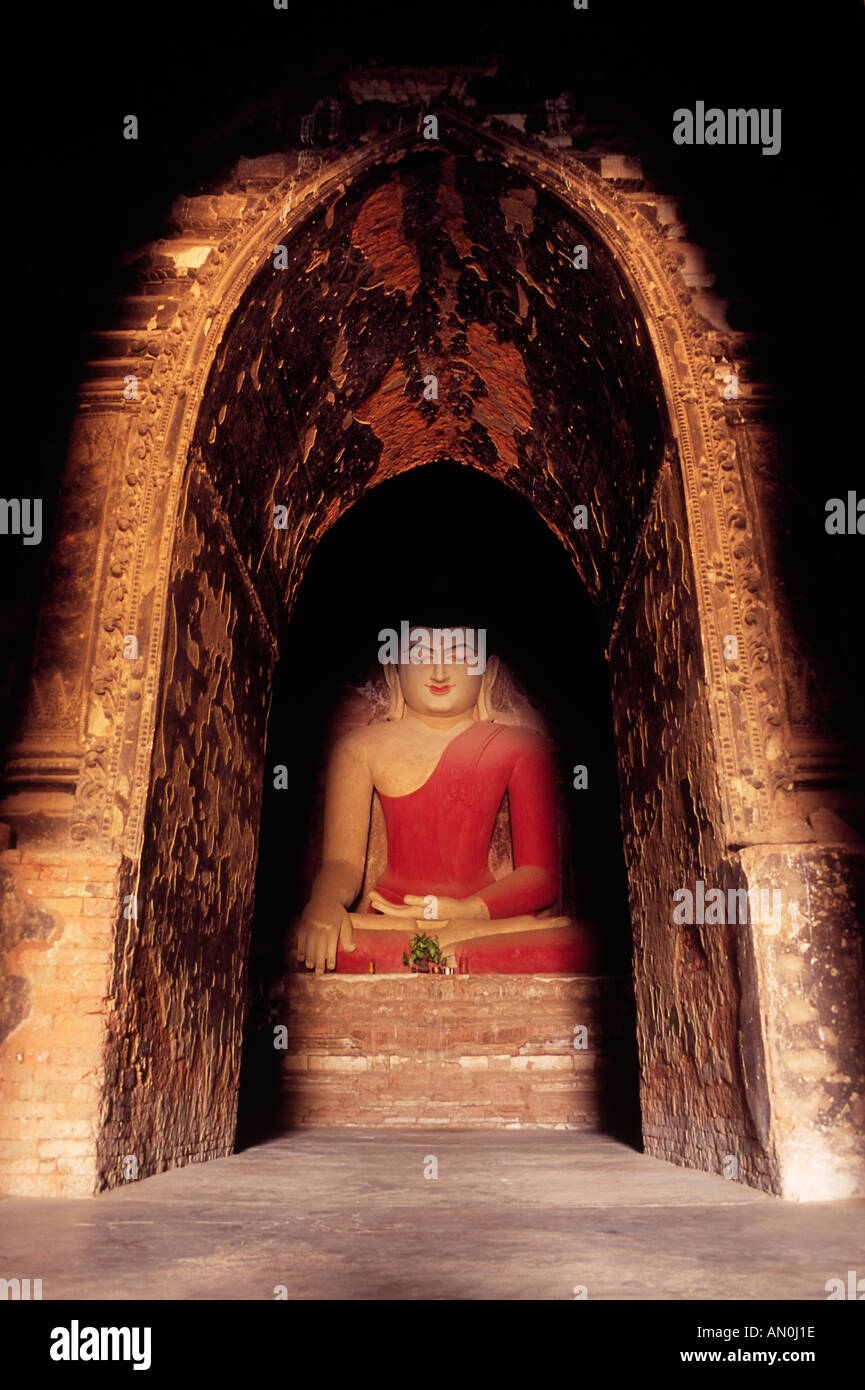 Buddha statue framed by the door opening in a pagoda of Bagan in Burma ...