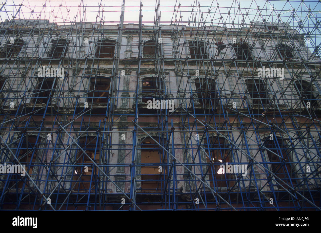 Ancient building in Havana, Cuba, covered in scaffolding in the process ...