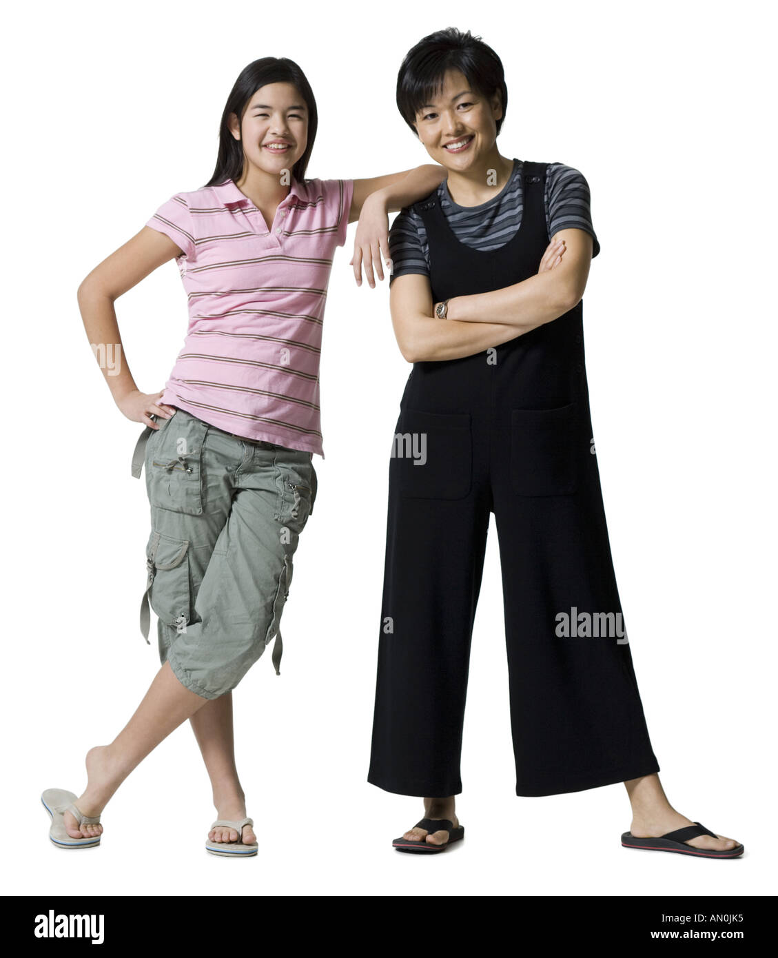 Portrait of a mother standing with her daughter Stock Photo - Alamy