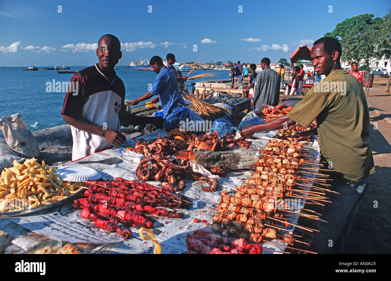 Stalls of freshly cooked seafood on the waterfront at Forodhani Gardens ...