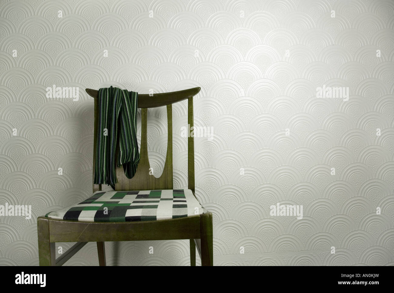 a scarf draped over the back of a chair Stock Photo - Alamy