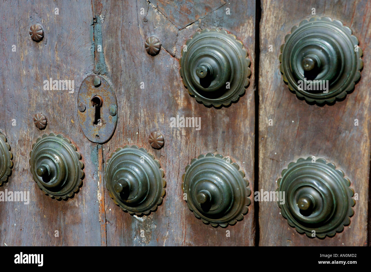 Keyhole of typical andalusian style wooden spiked door Stock Photo - Alamy