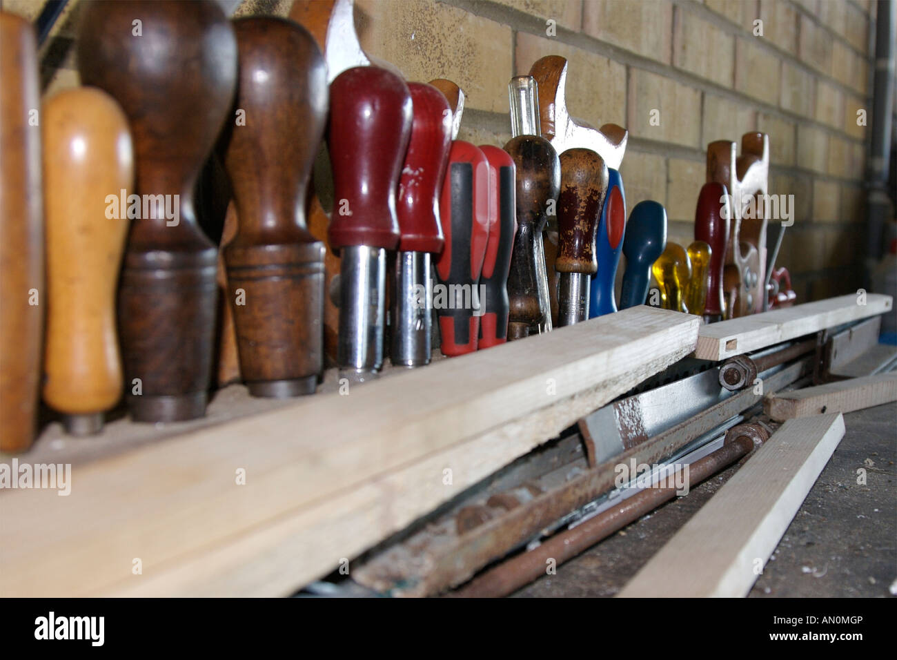 Craftsman's tools in a tool rack Stock Photo - Alamy