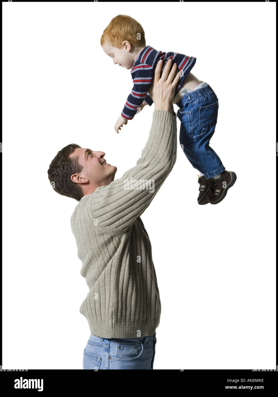 Profile of a father catching his son Stock Photo - Alamy