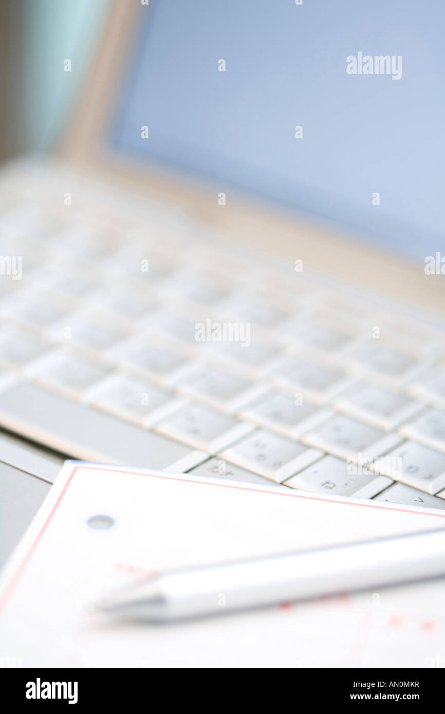 Personal computer and slip Stock Photo - Alamy