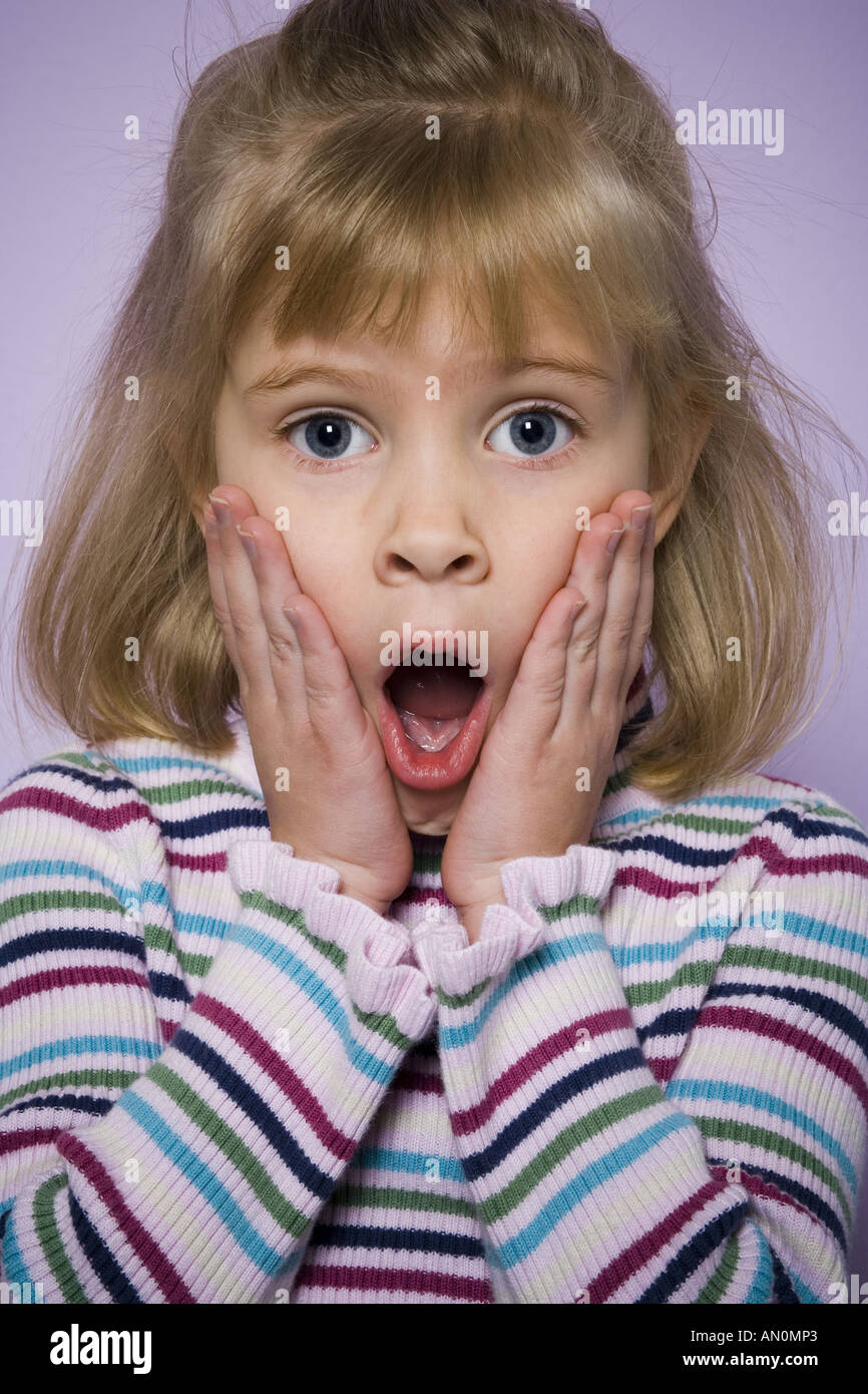 Portrait of a girl looking surprised Stock Photo - Alamy