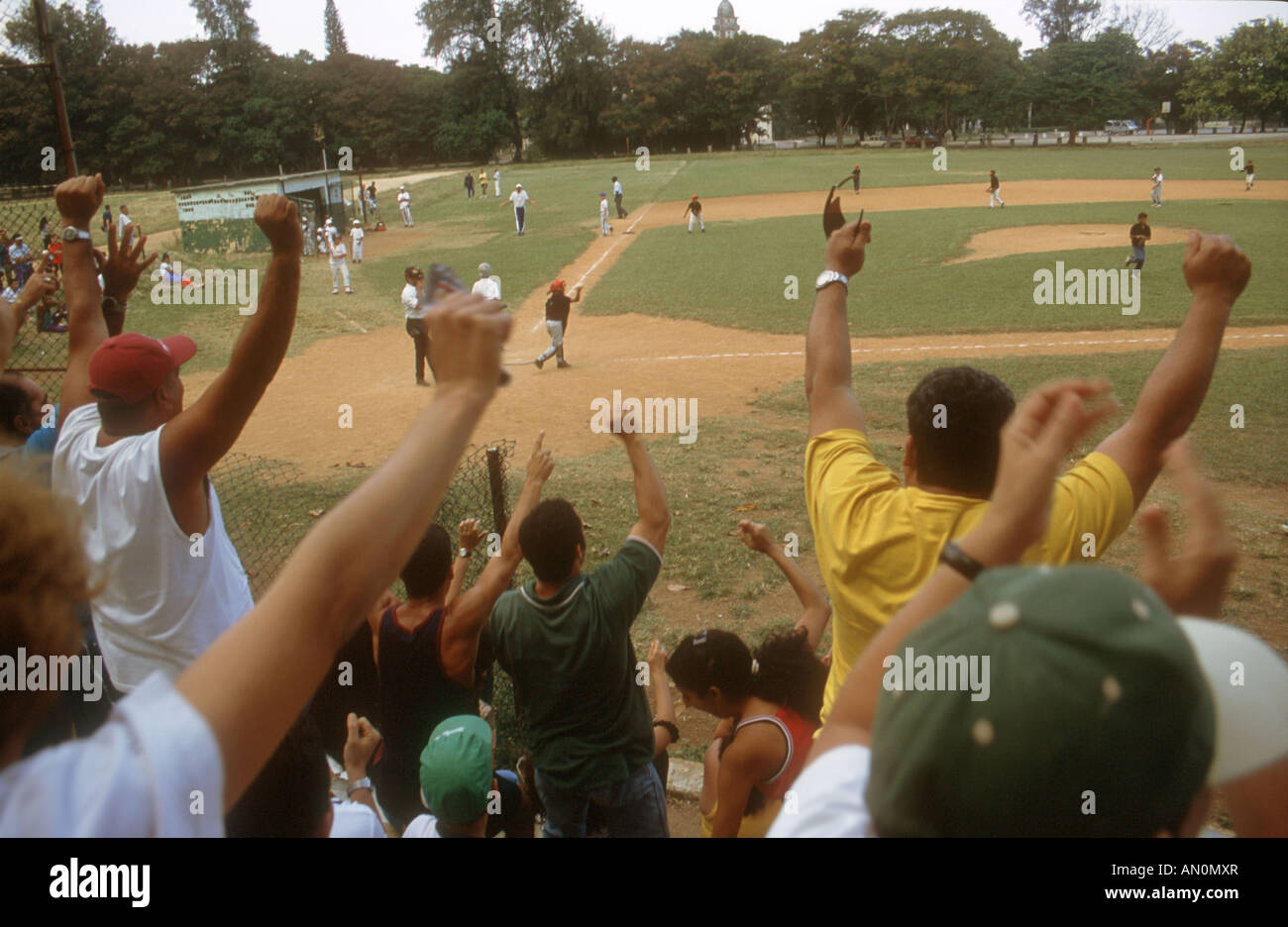 Crowd of spectators leaping to their feet in applause at a baseball ...