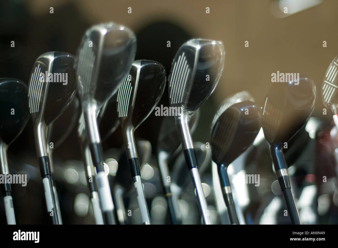Golf clubs in a shop window display Stock Photo - Alamy