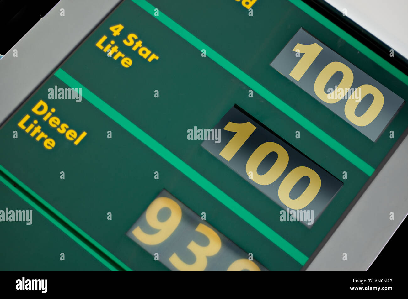 Petrol prices reach one pound per litre Board showing prices on garage ...
