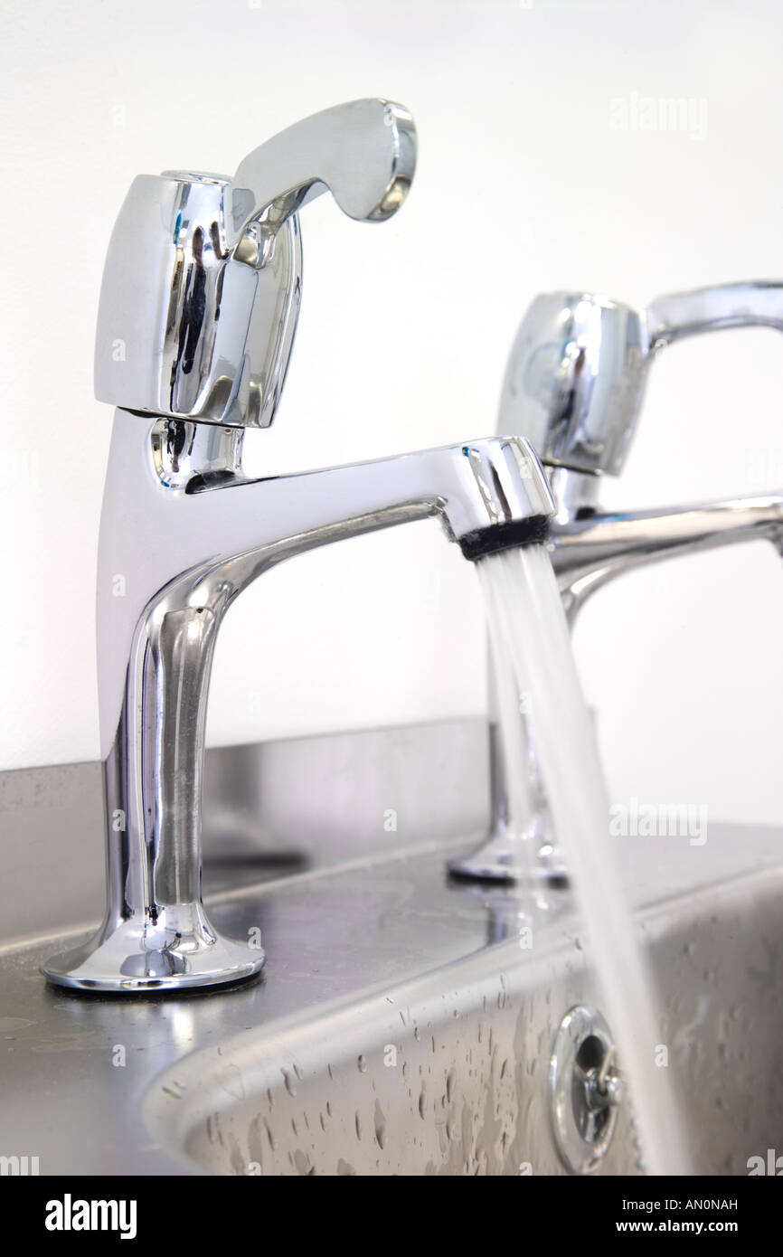 water tap with running water Stock Photo - Alamy