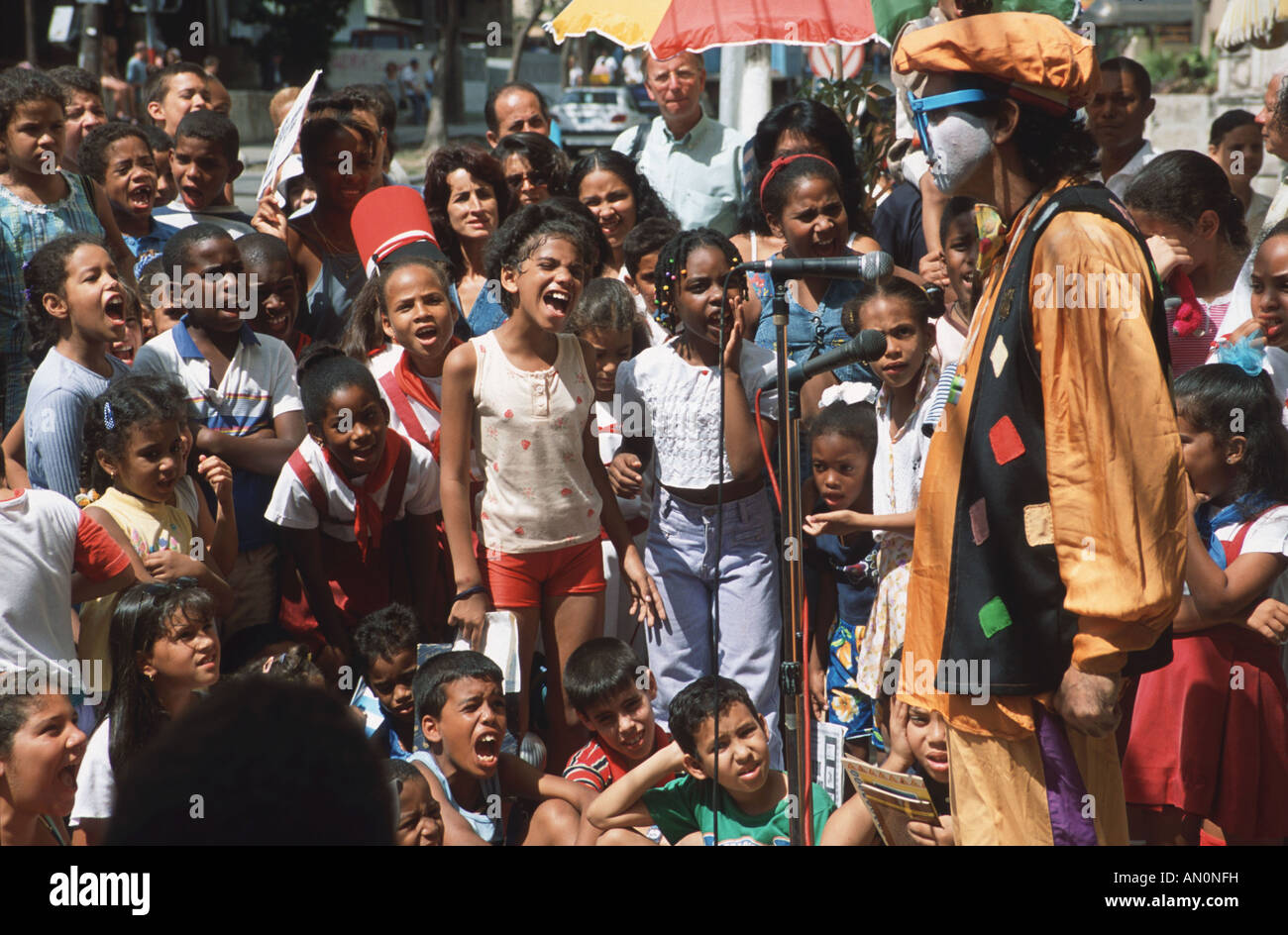 Clown entertaining group of children on the streets of Havana, Cuba ...