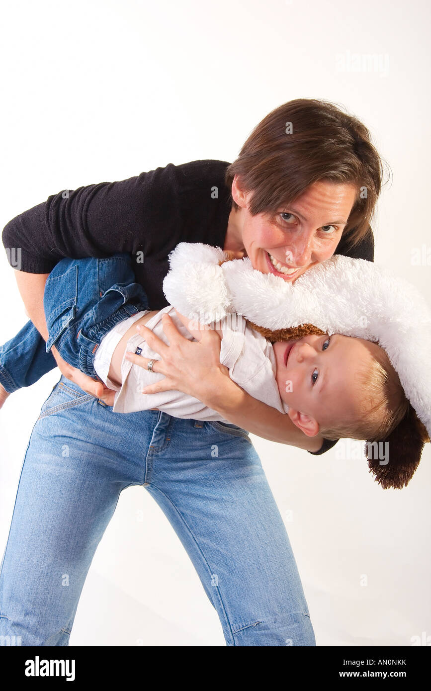 Young Boy White Background Setting With Mother Having Fun Stock Photo ...