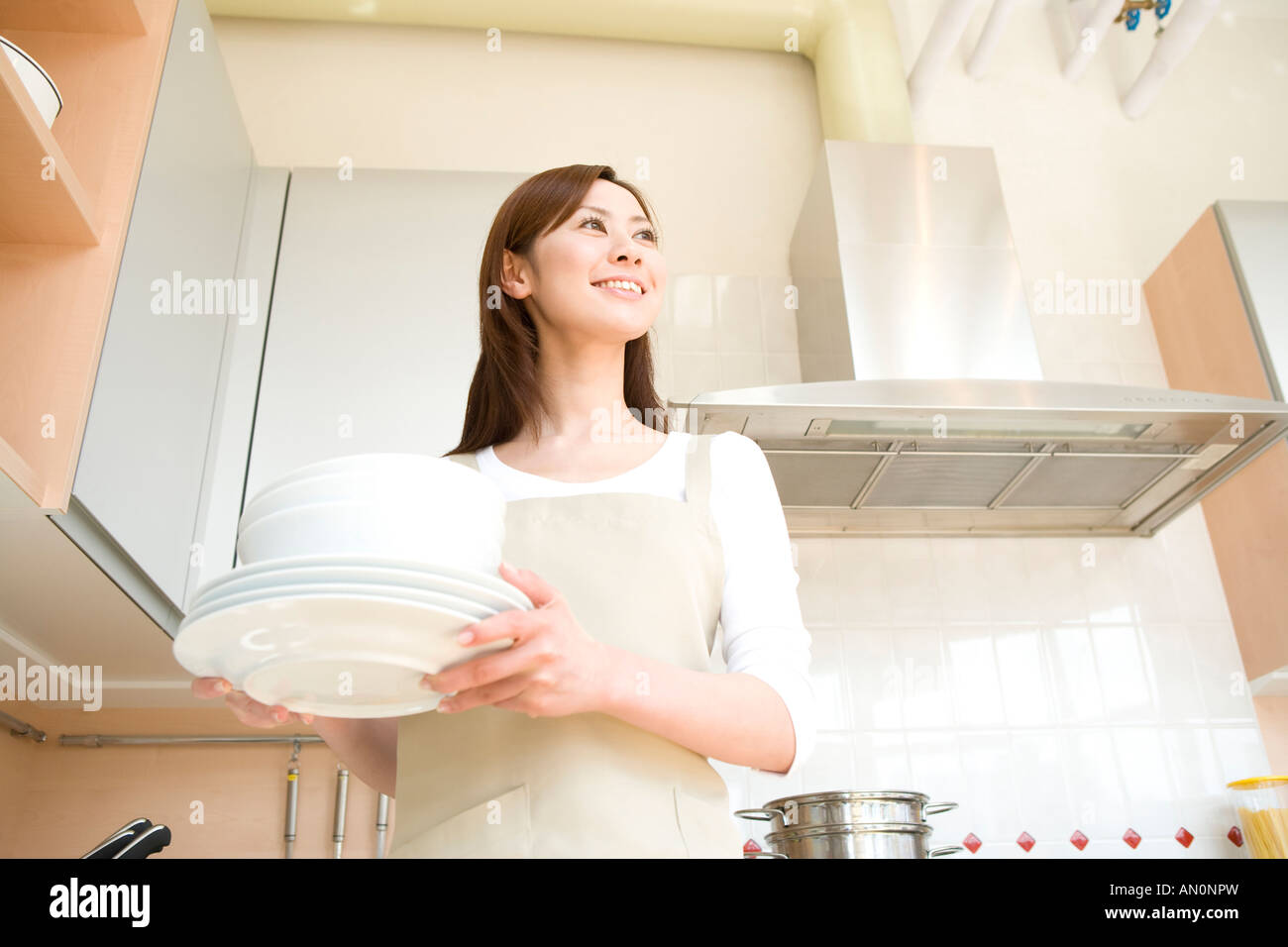 Japanese woman carrying dishes Stock Photo - Alamy