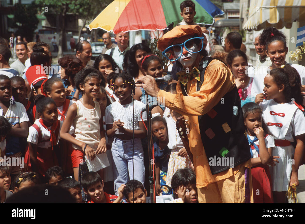Clown entertaining group of children on the streets of Havana, Cuba ...