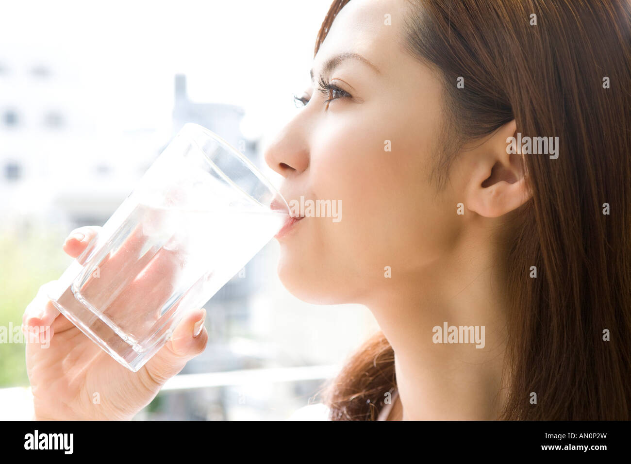 Japanese woman drinking a water Stock Photo - Alamy
