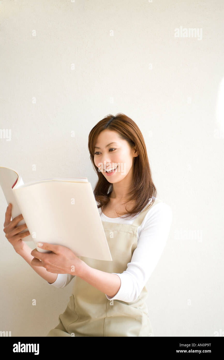 Japanese woman reading a book Stock Photo - Alamy