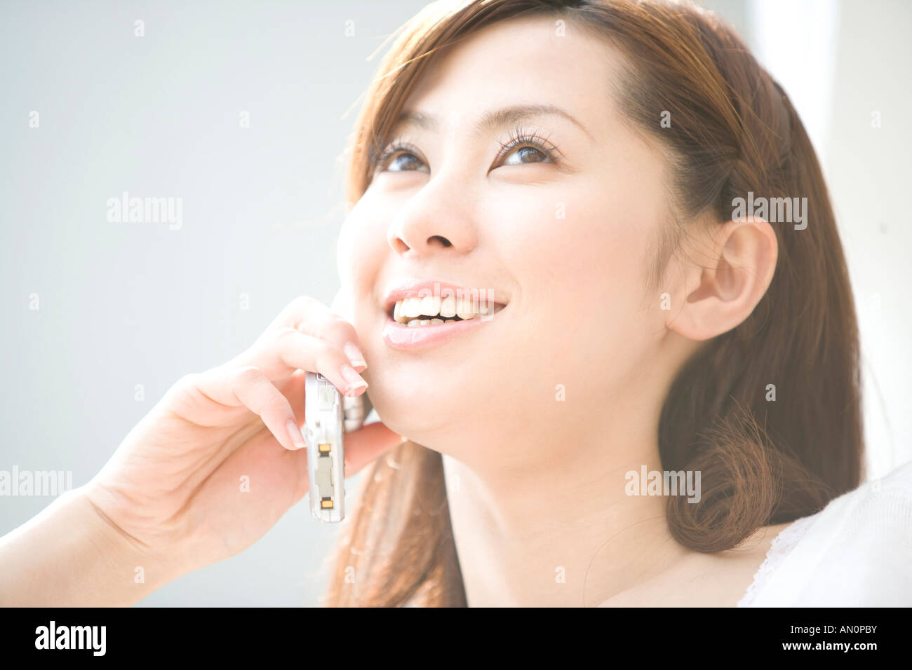 Japanese woman talking with cell phone Stock Photo - Alamy