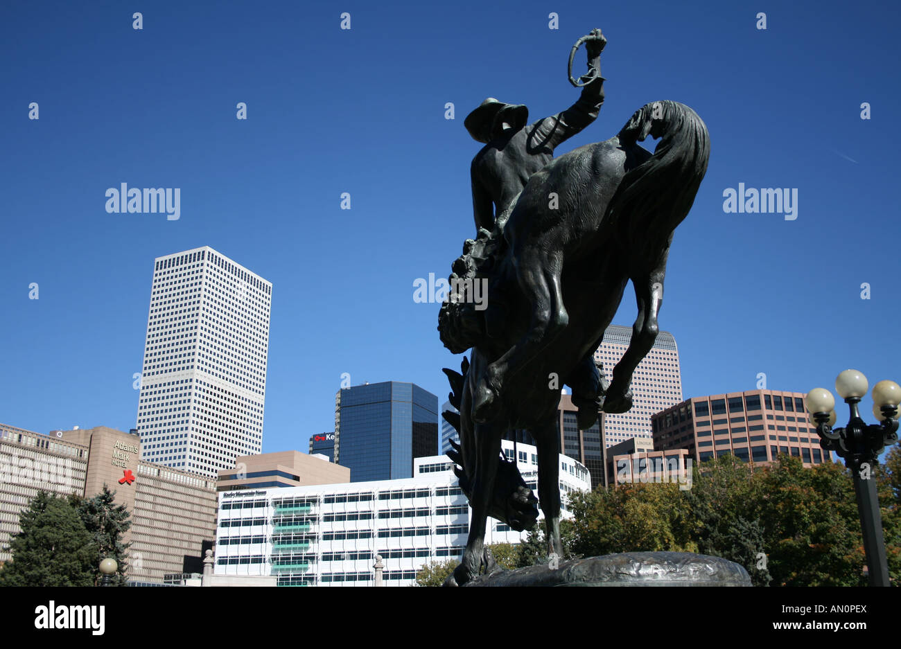 Statue of cowboy on horse and Denver skyline Colorado October 2007 ...