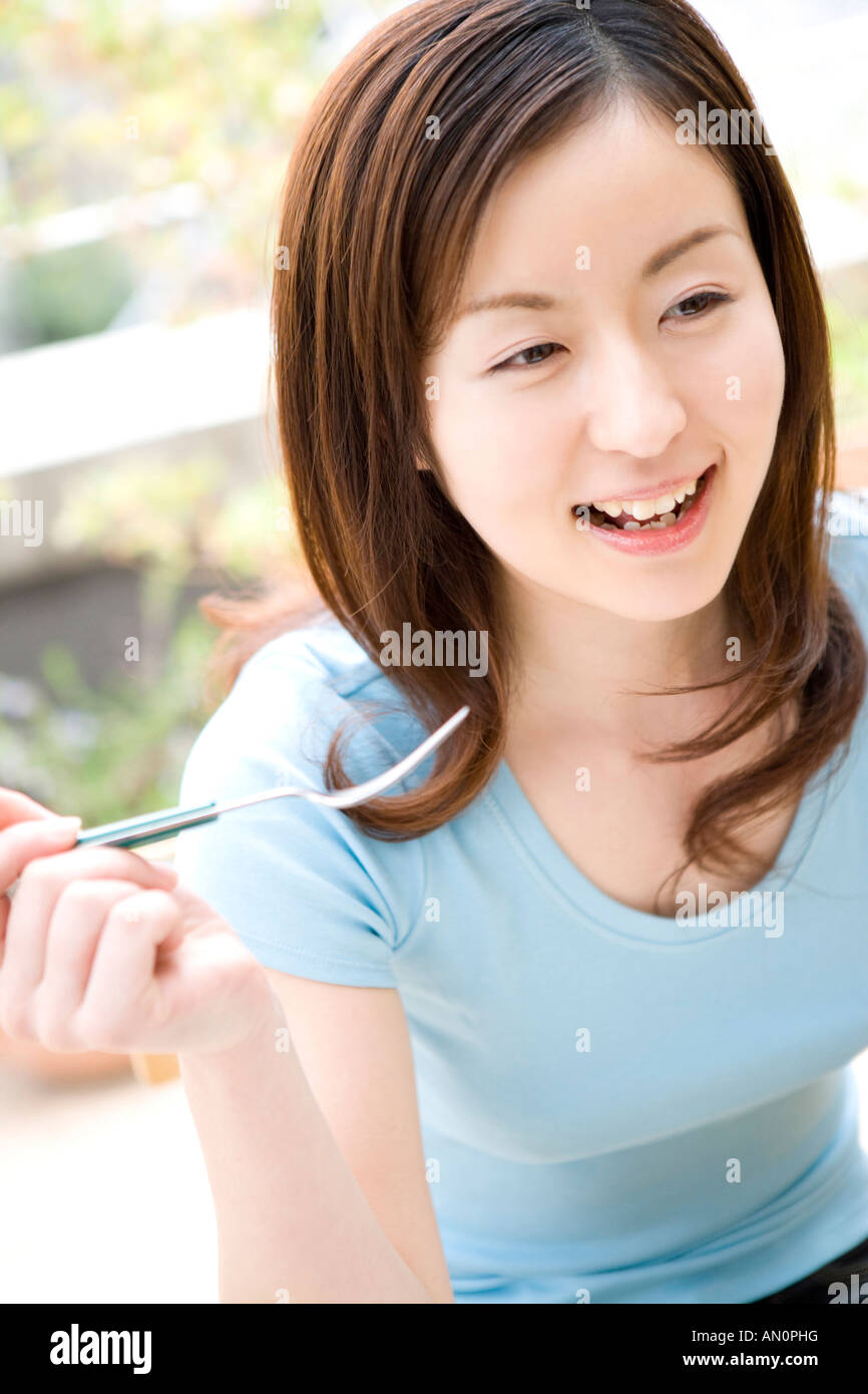 Smiling Japanese woman Stock Photo - Alamy
