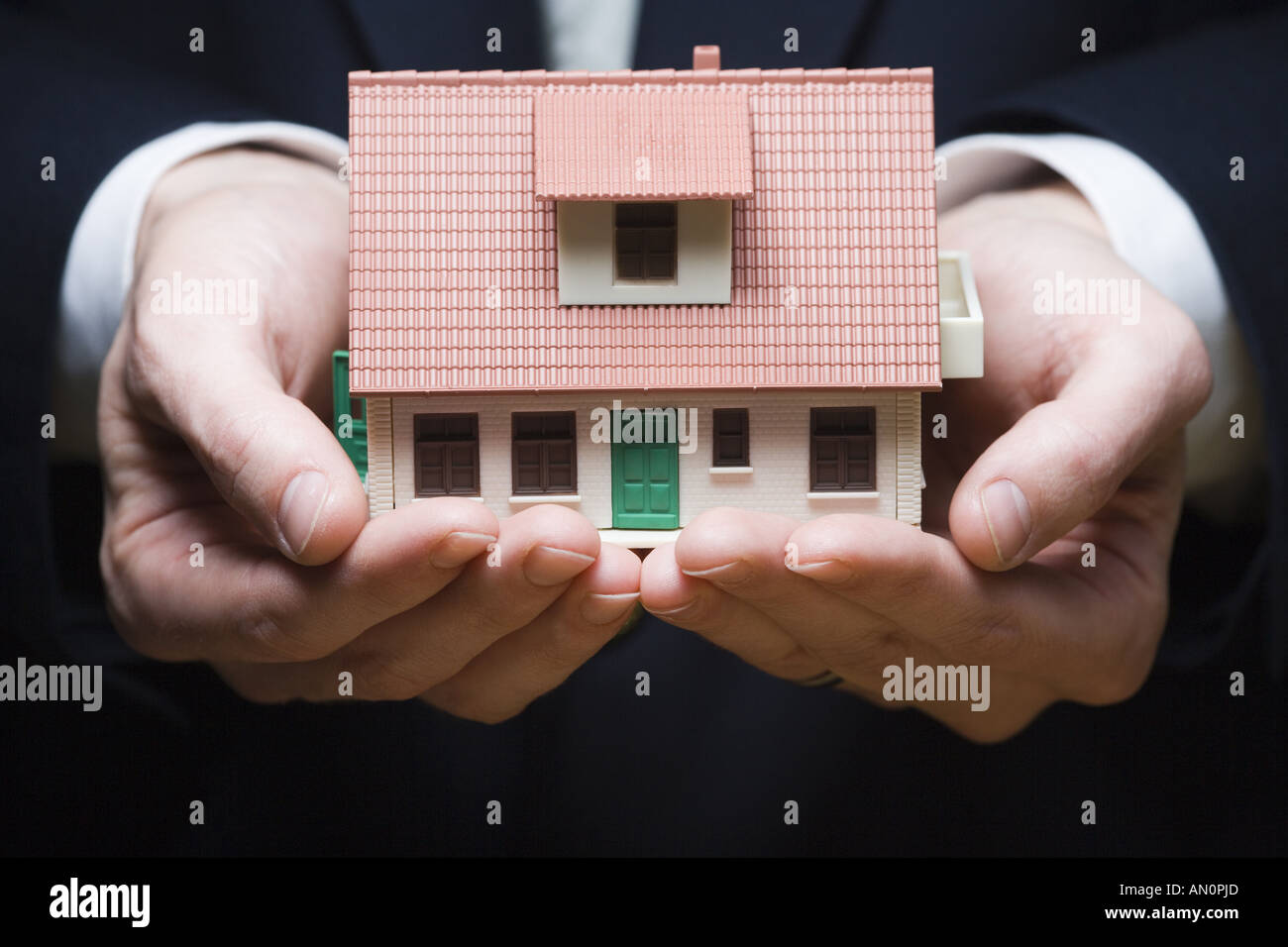 Businessman house model on hi-res stock photography and images - Alamy