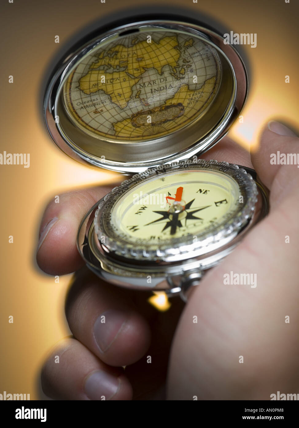 Hand holding compass Stock Photo - Alamy