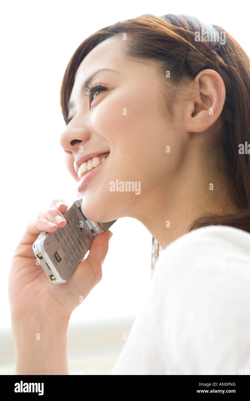 Japanese woman talking with cell phone Stock Photo - Alamy