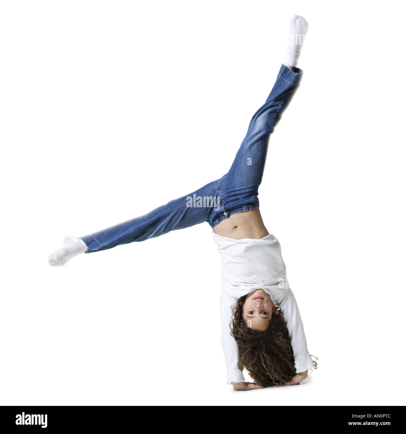 Girl doing a cartwheel Cut Out Stock Images & Pictures - Alamy
