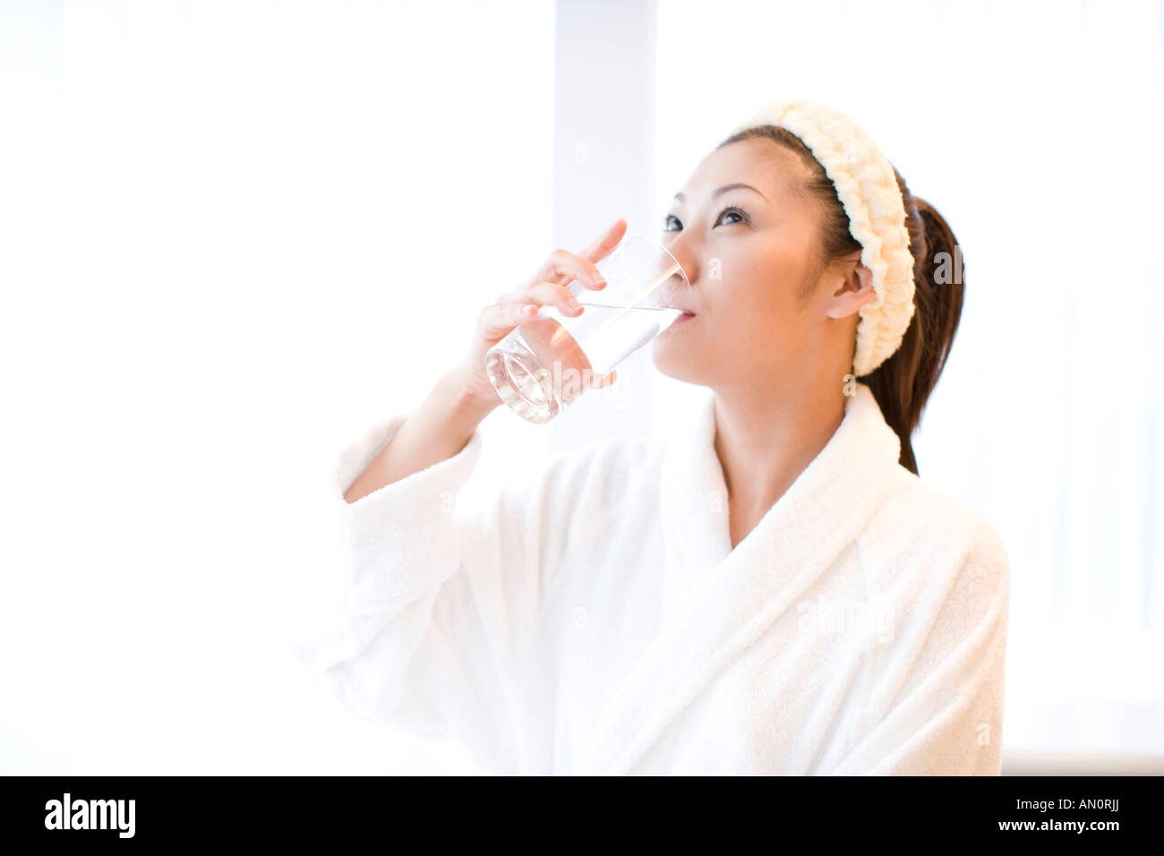 Japanese woman drinking a water Stock Photo - Alamy