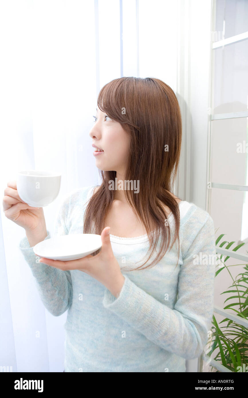 Japanese woman drinking coffee Stock Photo - Alamy
