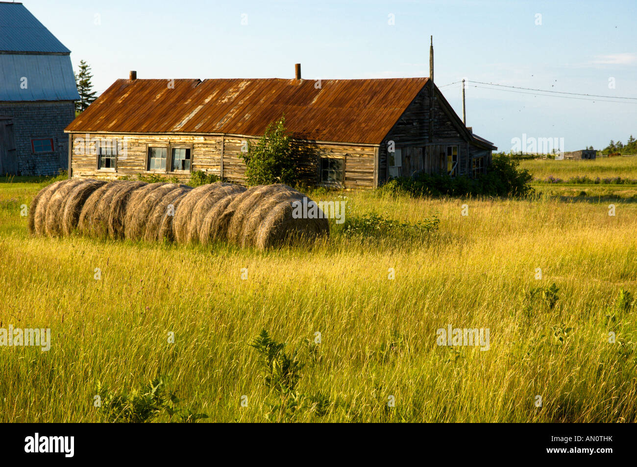 Hay bale in front of an old blacksmith shop at sunset Stock Photo - Alamy