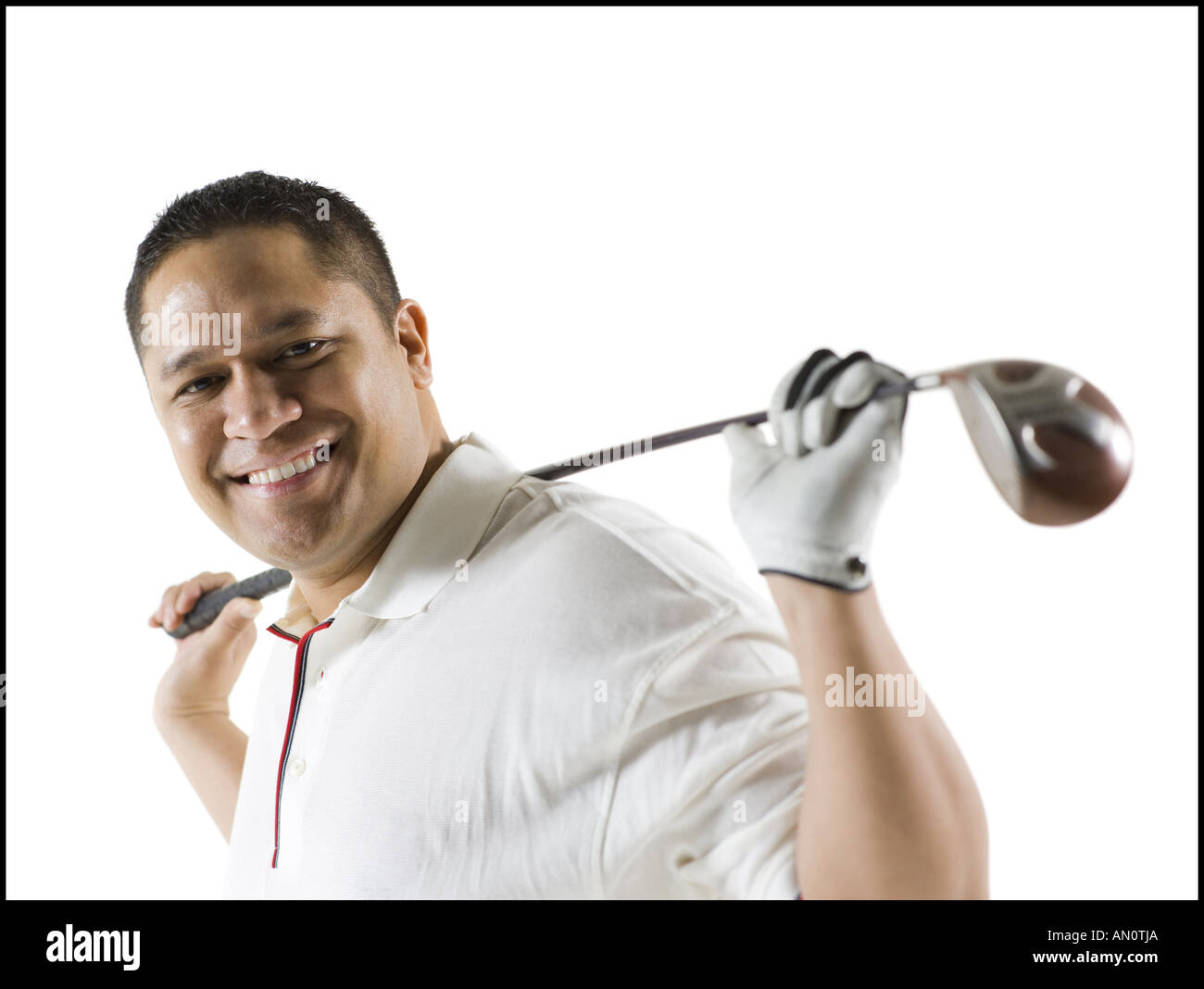 Portrait of a mid adult man holding a golf club Stock Photo - Alamy