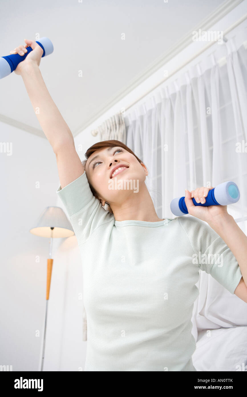 Japanese woman doing exercise Stock Photo - Alamy