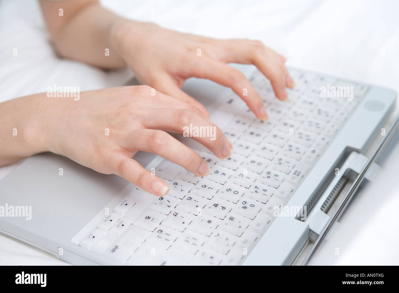 Hands tapping a keyboard Stock Photo - Alamy