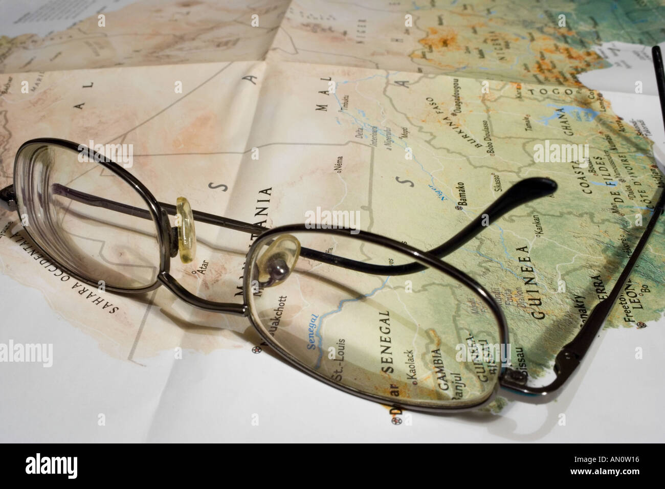 Glasses over map Stock Photo - Alamy