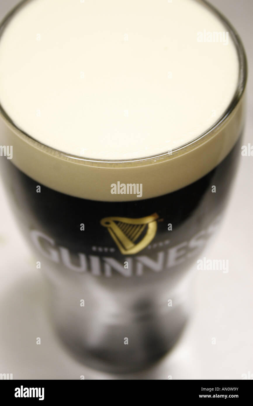 guiness in pint glass Stock Photo - Alamy