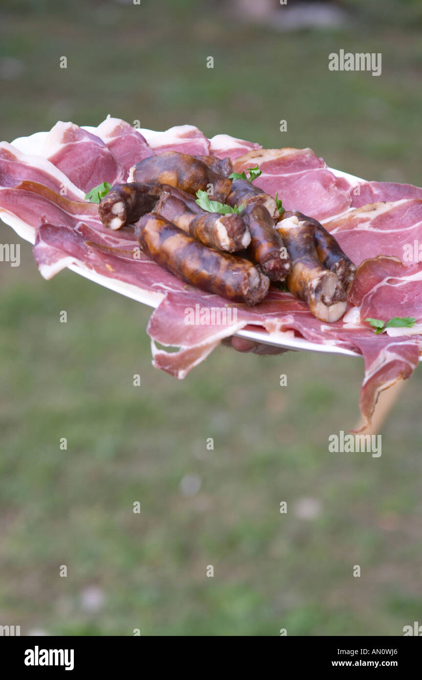 Montenegrin food speciality: a plate of dried and smoked cured ham and ...