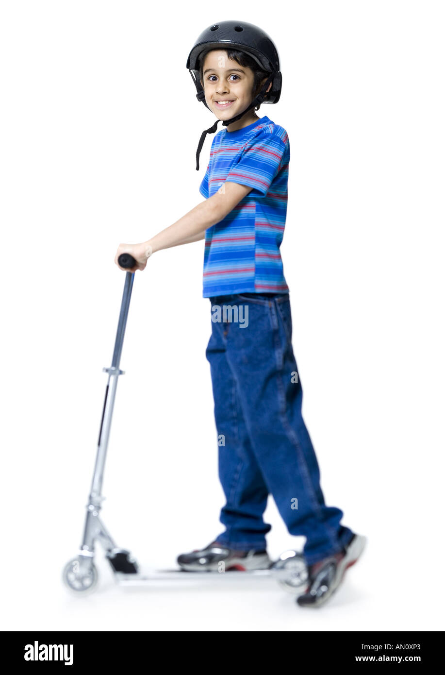 Profile of a boy riding a push scooter Stock Photo - Alamy