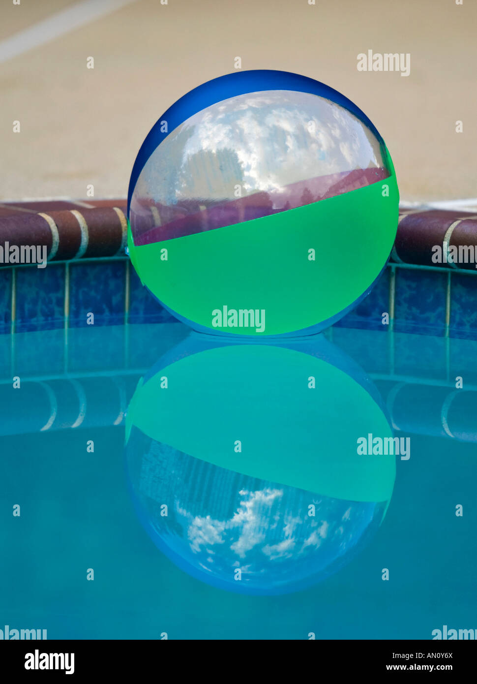 Inflatable ball in a backyard pool Stock Photo - Alamy