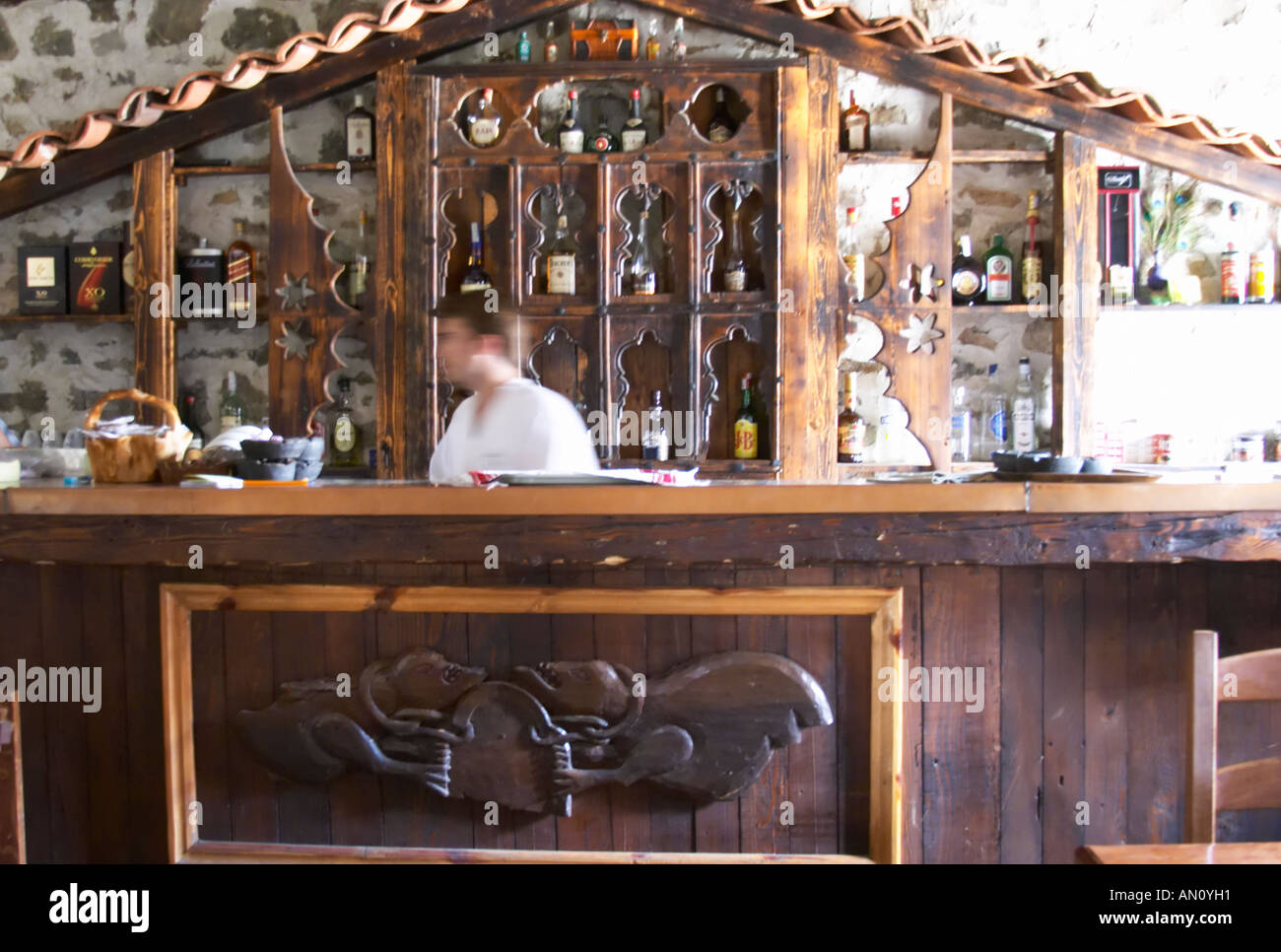 The upstairs bar with traditional country style wooden carvings and ...