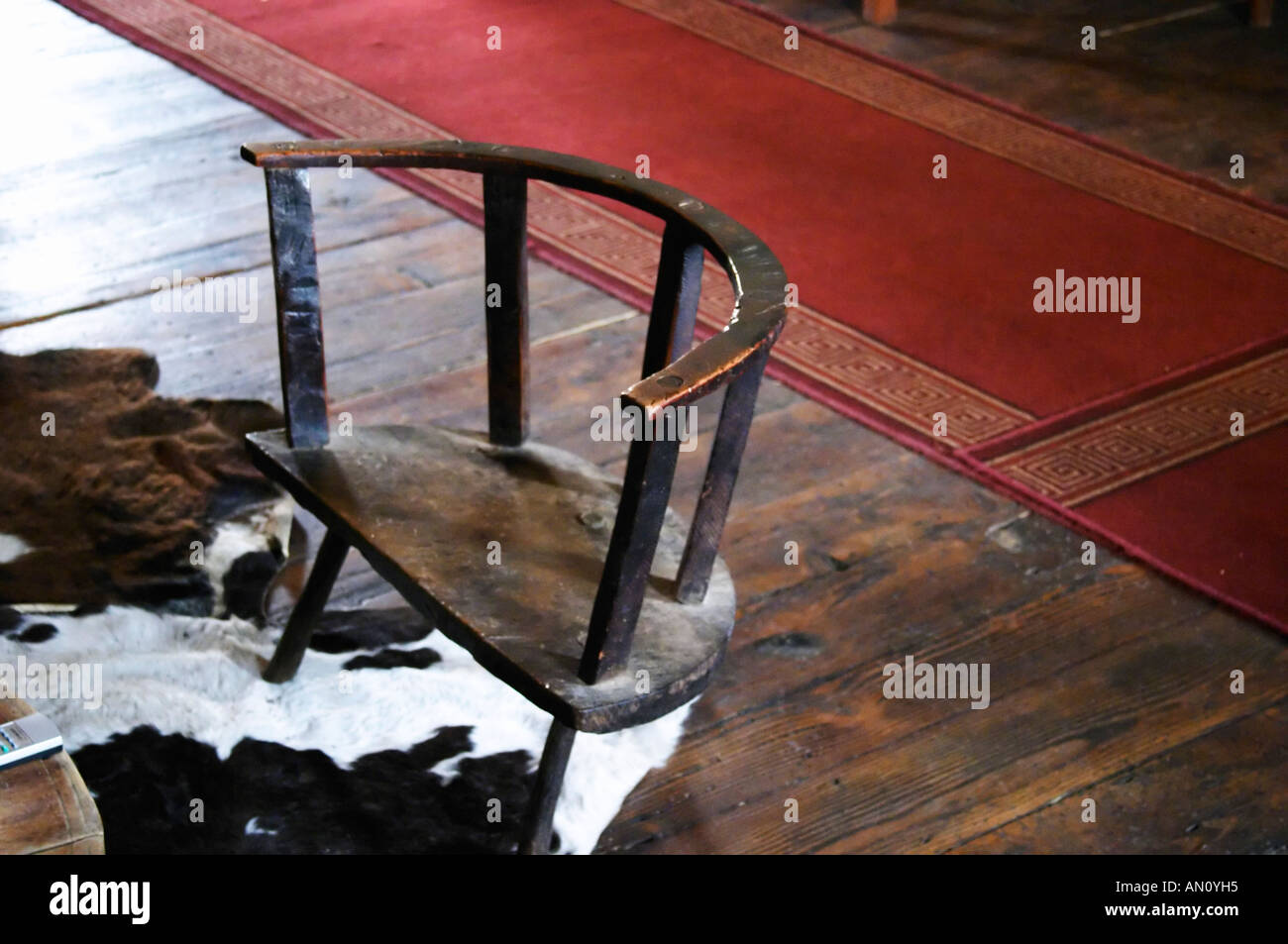 A traditional wooden three legged chair stool. It is the seat of the ...