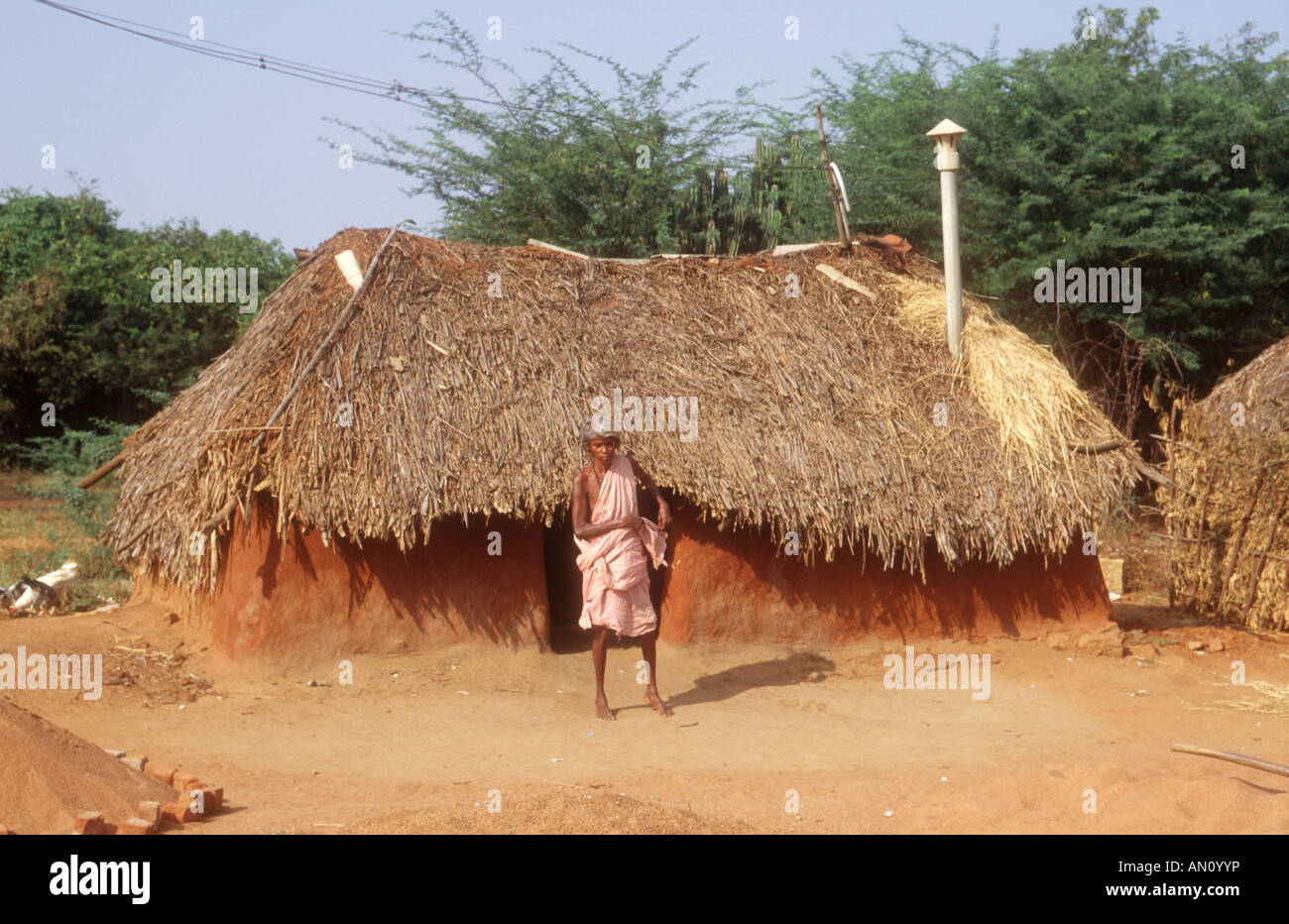 Woman standing outside a hut in a village in Tamil Nadu, India Stock ...