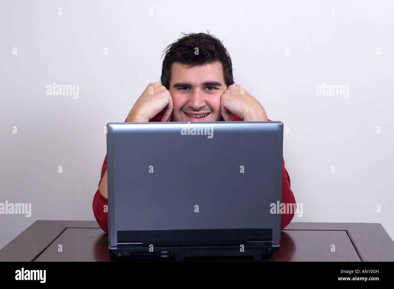 Man with laptop smiling Stock Photo - Alamy