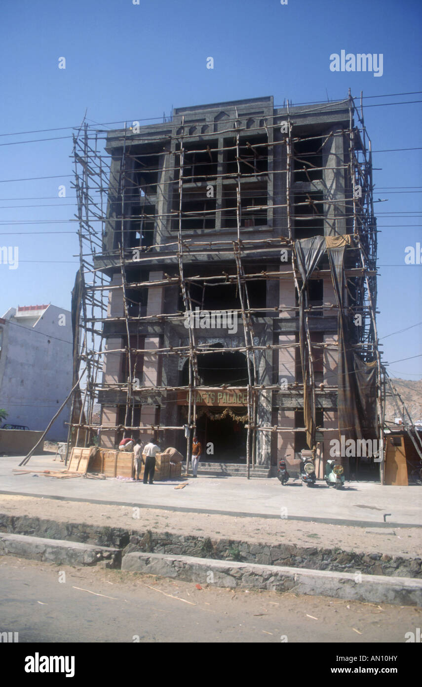 Rickety-looking wooden scaffolding on building being renovated in India ...